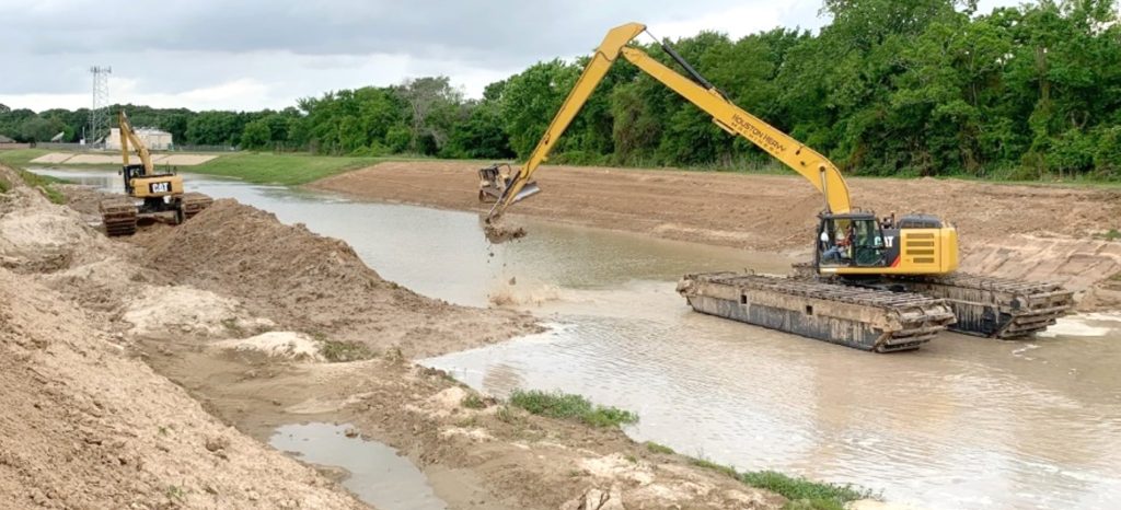 Flood Control with Amphibious Excavator – EIK Engineering Sdn Bhd